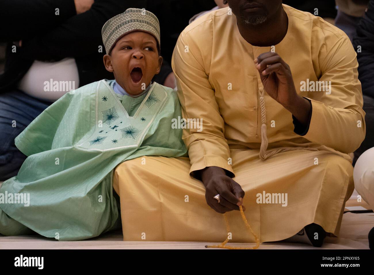 A boy yawns before Eid Al-Fitr prayers in Bucharest, Romania, Friday ...