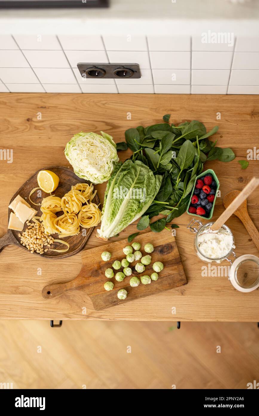 Raw food ingredients for preparation of vegetarian pasta Stock Photo ...