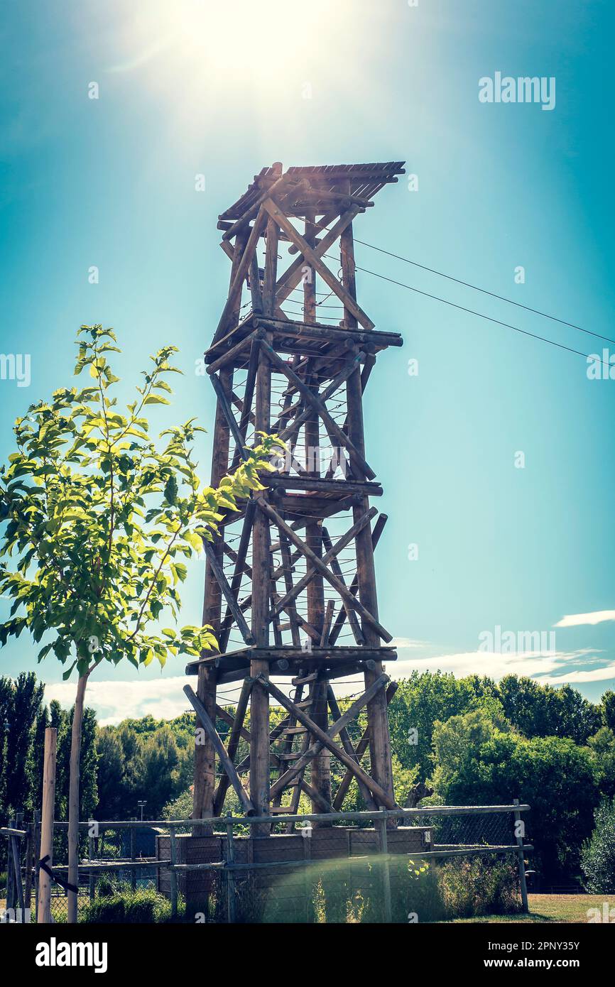 high zip line tower under the sun in summer Stock Photo - Alamy
