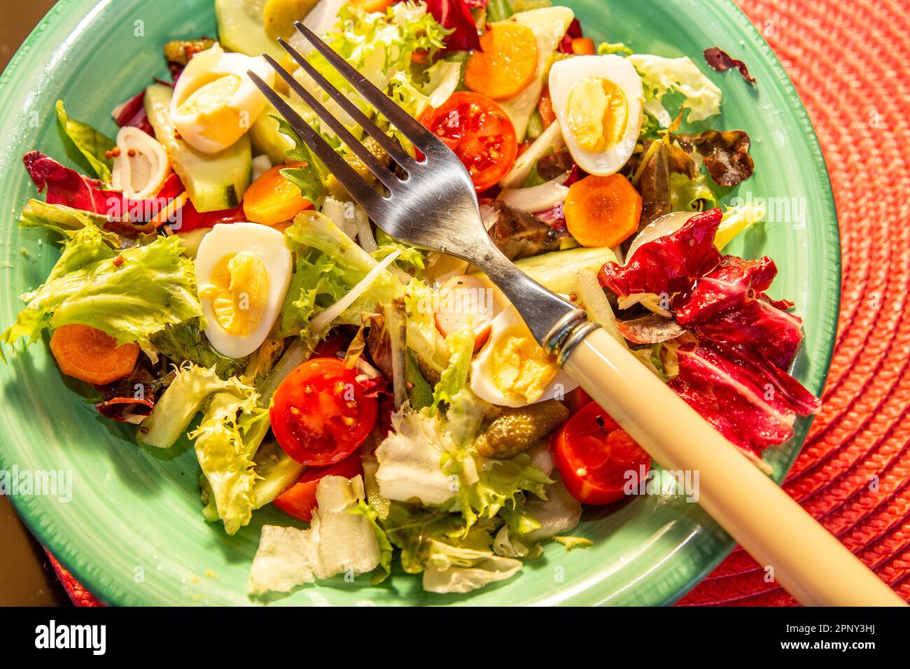 colorful image with green plate with mixed salad Stock Photo - Alamy