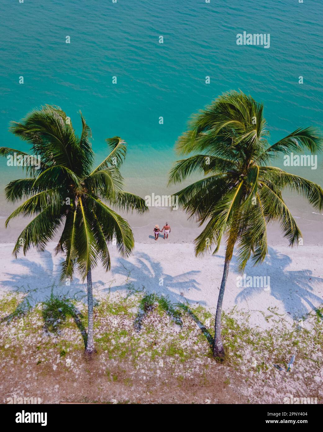 A couple of men and women on vacation at Koh Mook tropical Island in ...