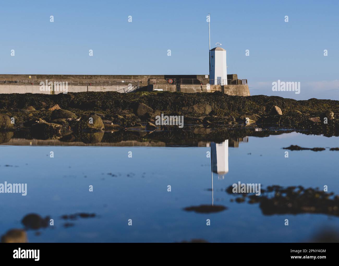 The harbour lighthouse at Seahouses, Northumberland Stock Photo - Alamy