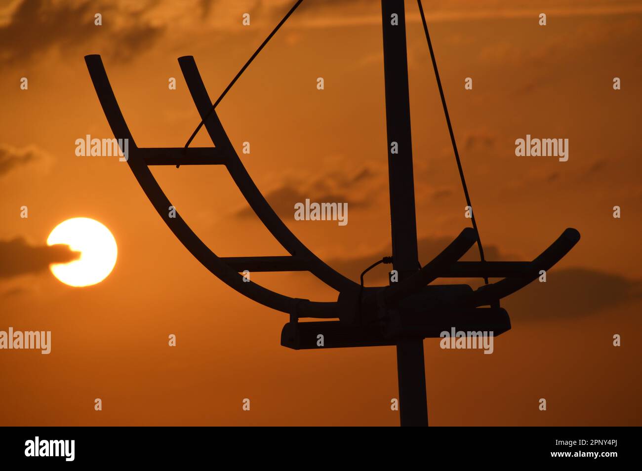 Sunset with a lampshape caravel shadow profile Stock Photo - Alamy