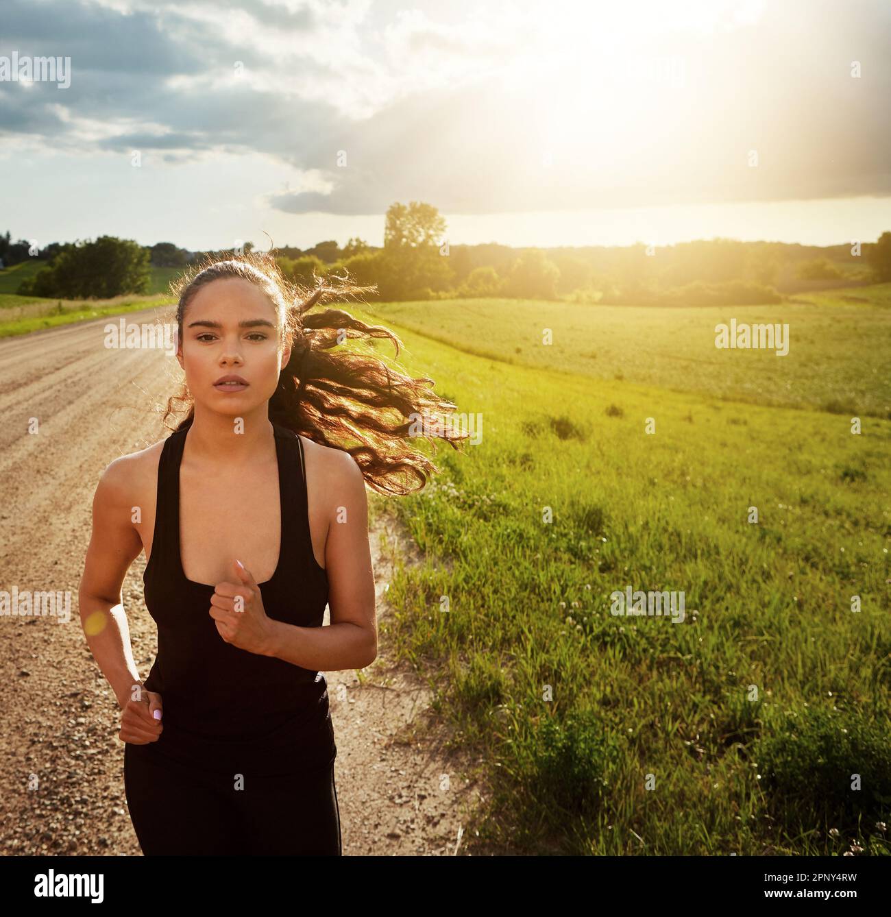 Your mindset is your toughest opponent. a fit young woman out for a run ...