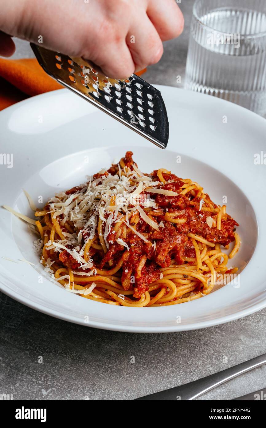 Chef rubs parmesan cheese hi-res stock photography and images - Alamy