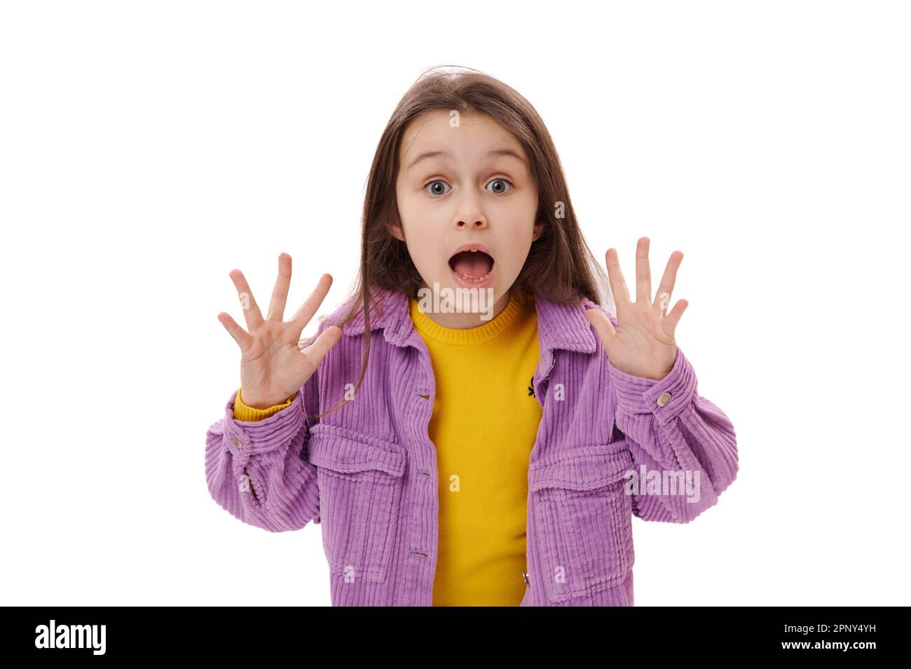 Scared beautiful child girl with afraid look, open mouth and hands ...