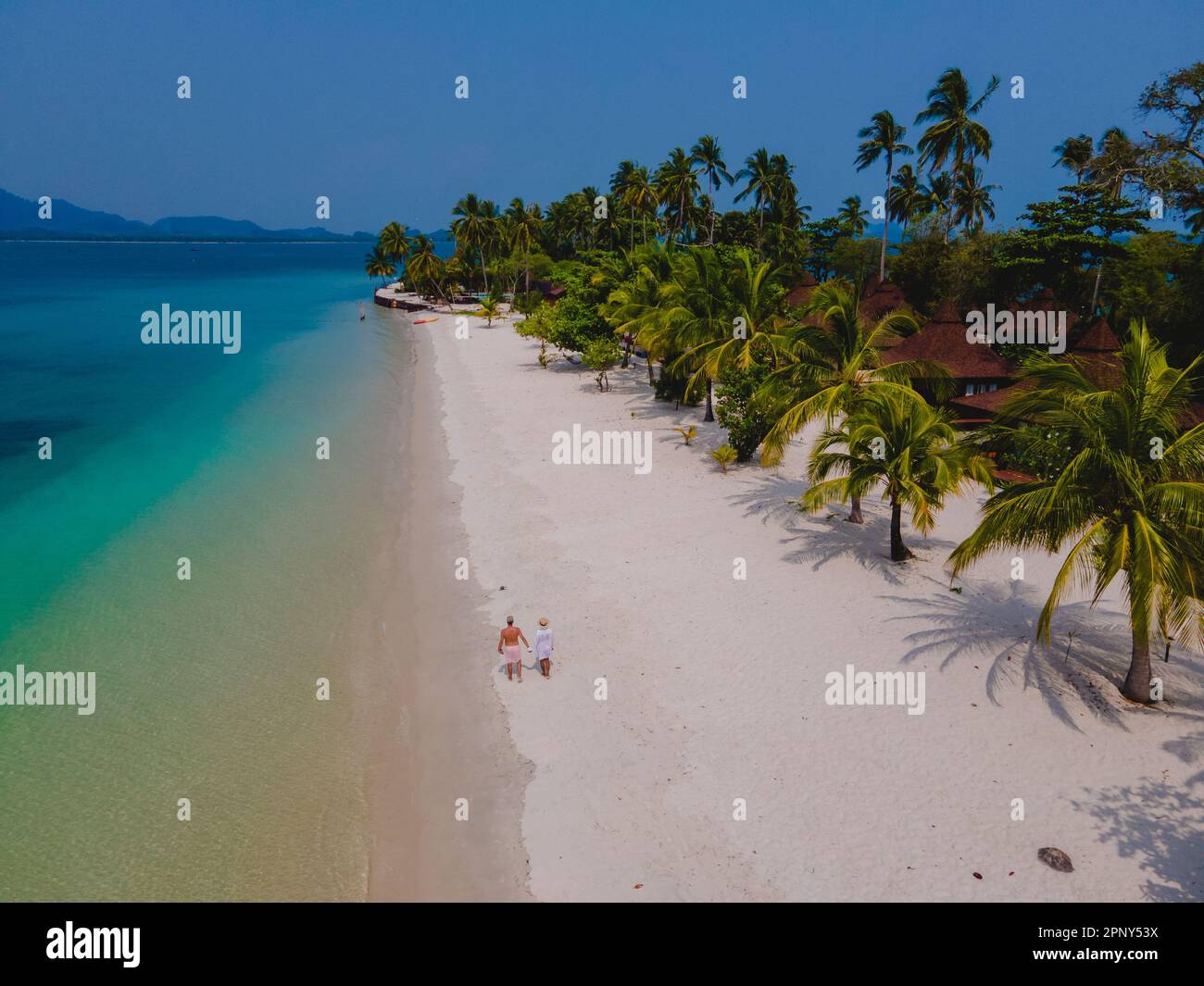 A couple of men and women on vacation at Koh Mook tropical Island in ...