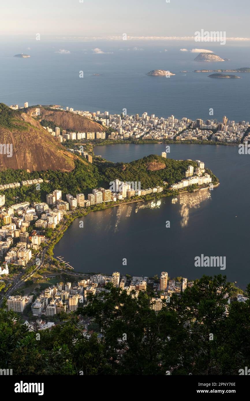 Beautiful view to lagoon city buildings and green rainforest hills ...