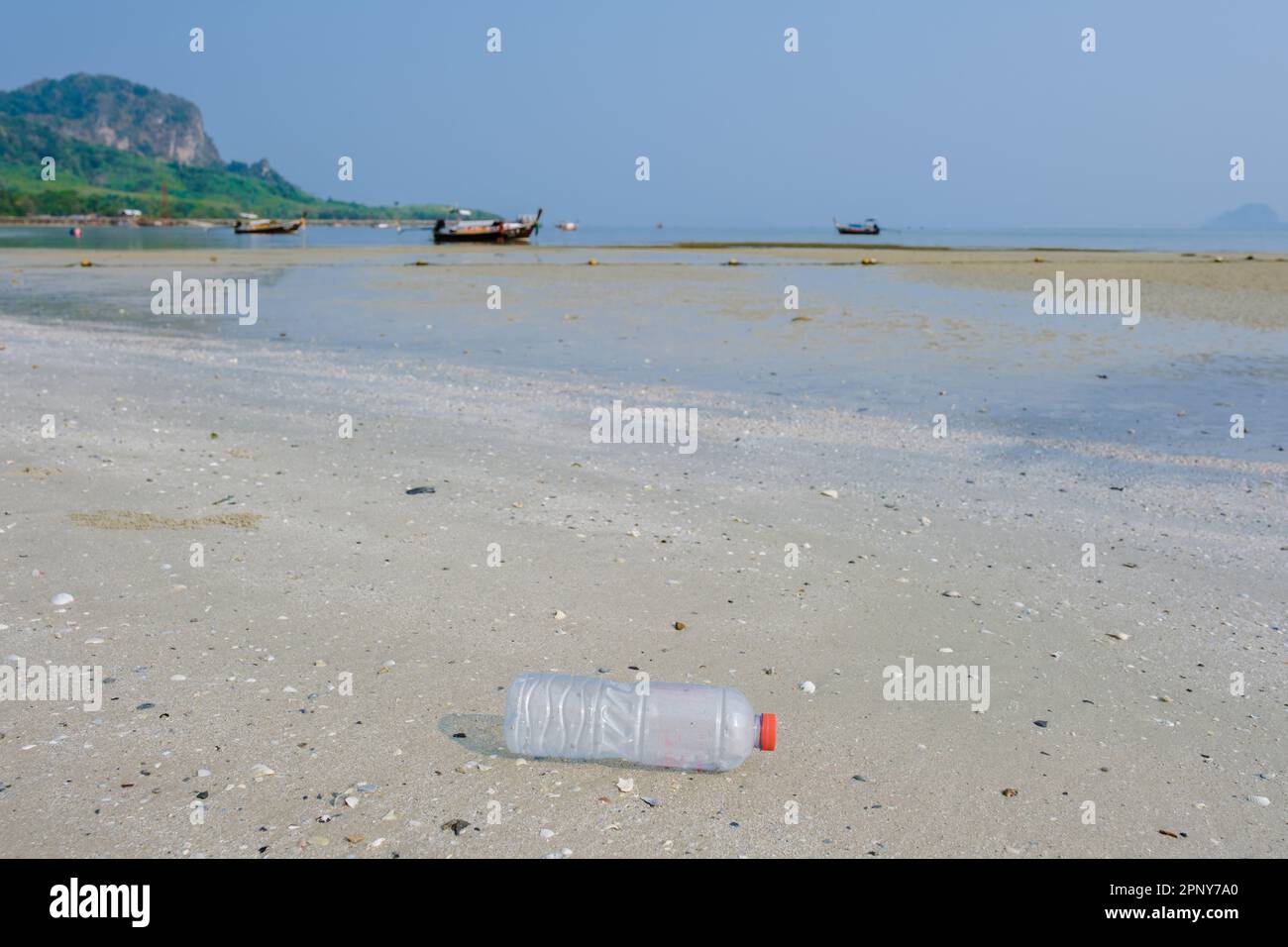 plastic bottle on a beach in Thailand Stock Photo - Alamy