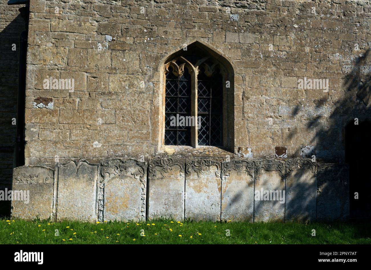 South facing window and old gravestones, St. Andrew`s Church, Cranford ...