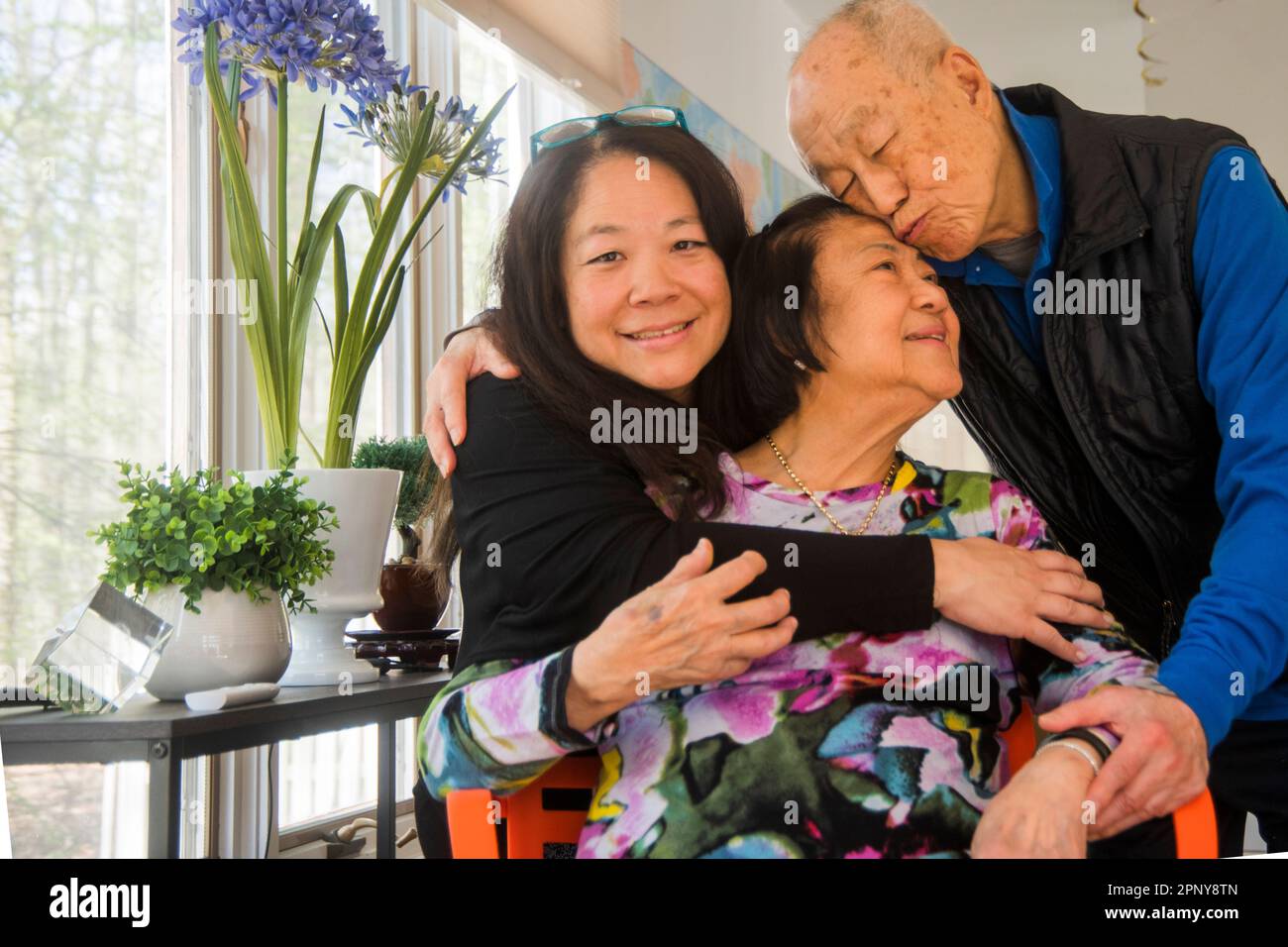 Senior retirees with adult daughter Stock Photo - Alamy