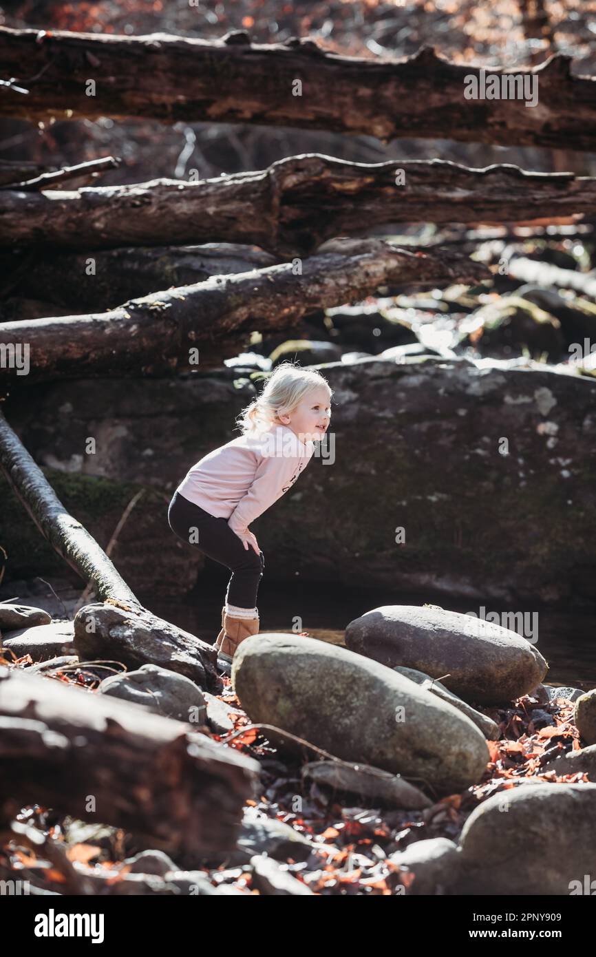 Happy girl playing in scenic rocky nature area Stock Photo - Alamy
