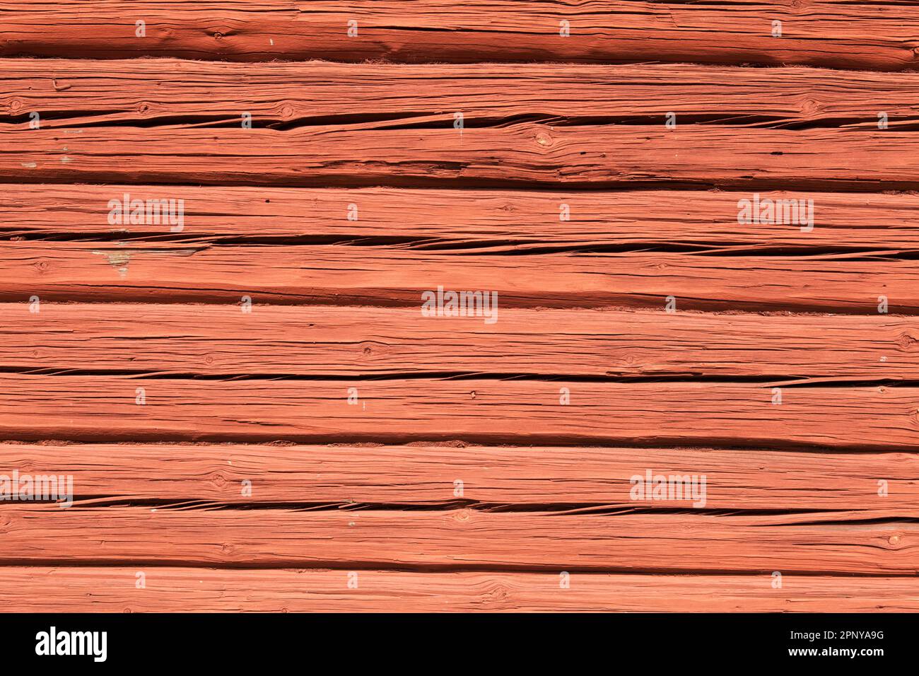 Closeup, macro of red painted logs, timber on a building's wall ...