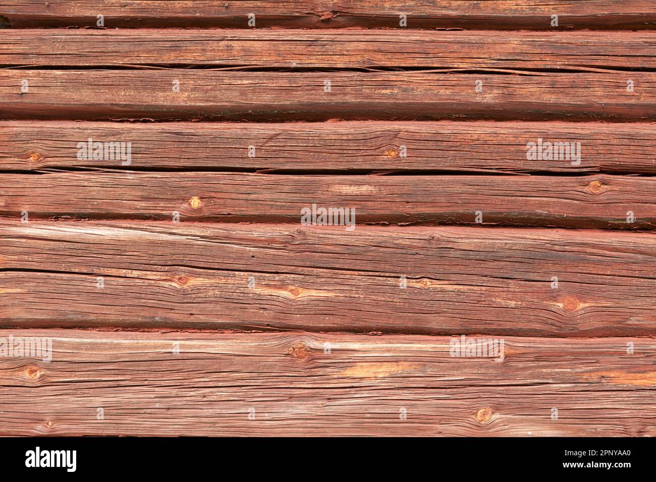 Closeup, macro of red painted logs, timber on a building's wall ...