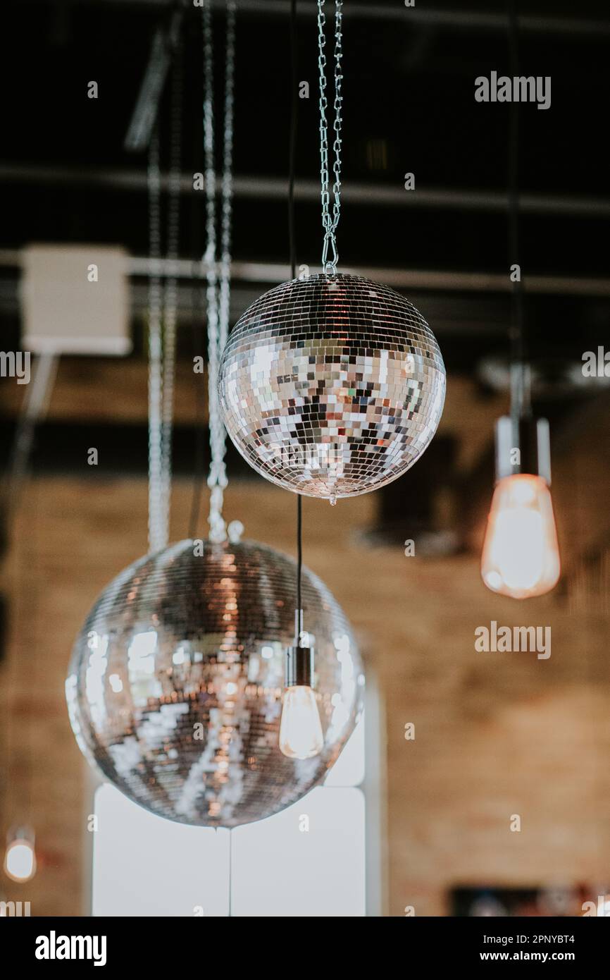 Hanging Disco Balls in a wedding Venue with string lights Stock Photo ...