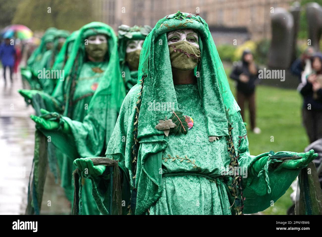 Extinction Rebellion demonstrators from the Green Brigade march in ...