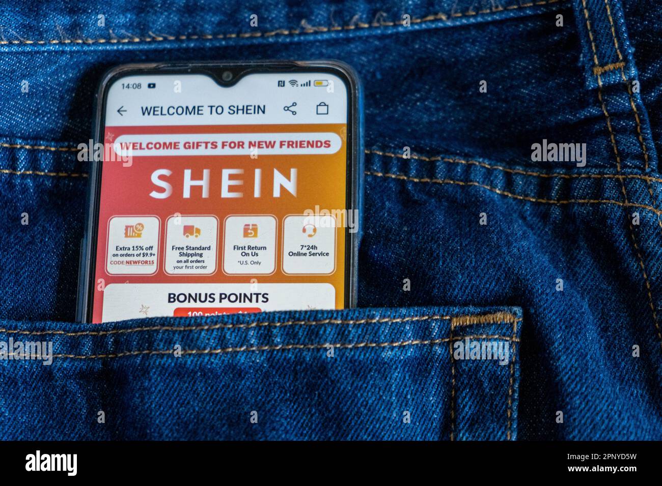 Madrid, Spain. 04-20-2023: Smartphone in the front pocket of a jean, on ...