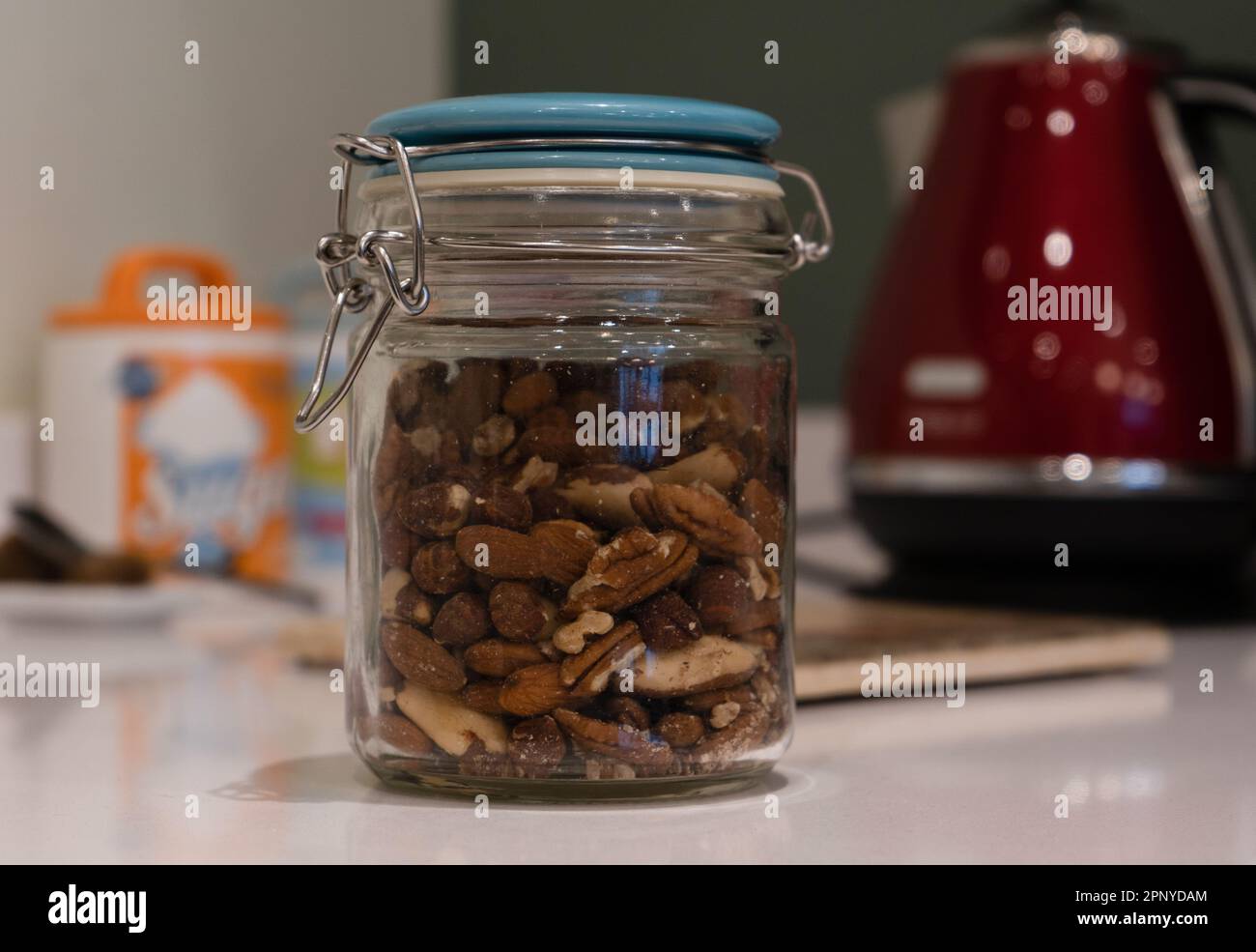 A jar of nuts on a kitchen counter Stock Photo - Alamy
