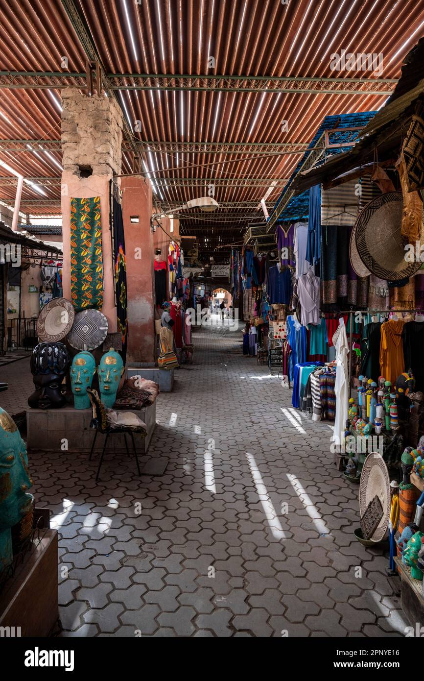 Street in the medina of Marrakesh with a multitude of small souvenir ...