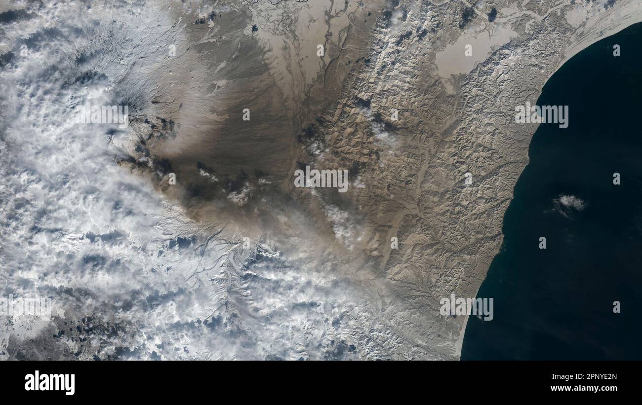 High altitude aerial of Kamchatka showing the eruption of the volcano ...