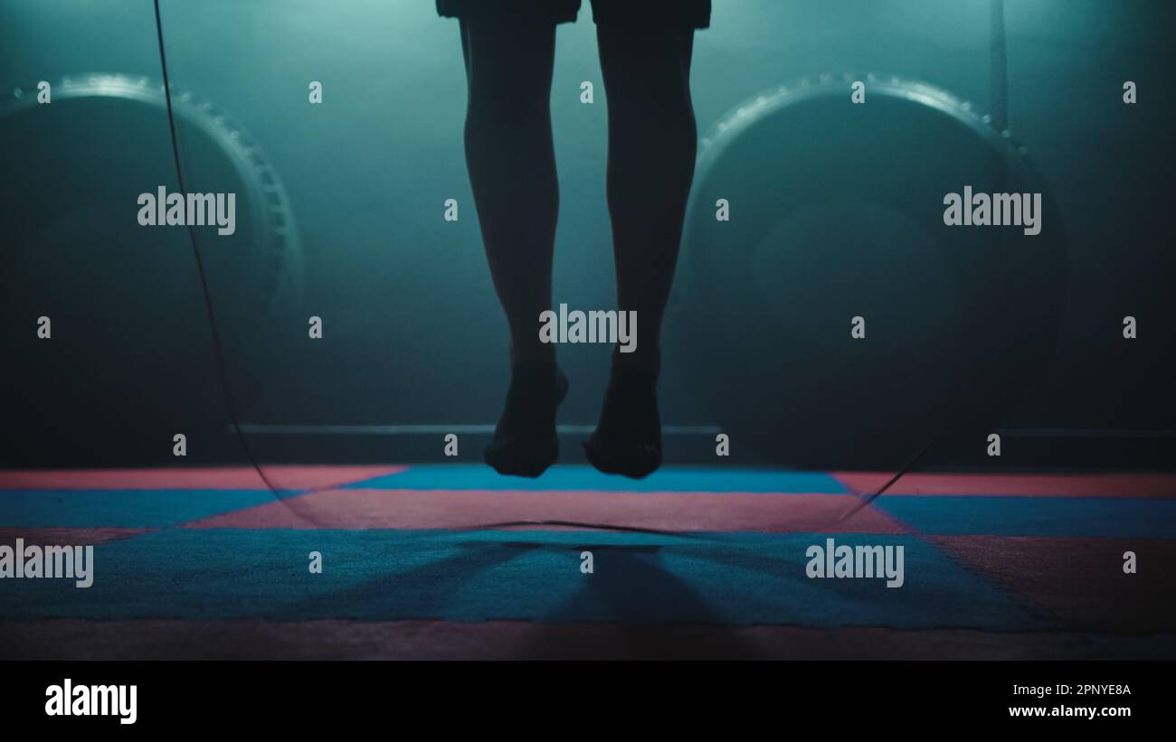 Man using a jumping rope to improve muscle strength Stock Photo - Alamy