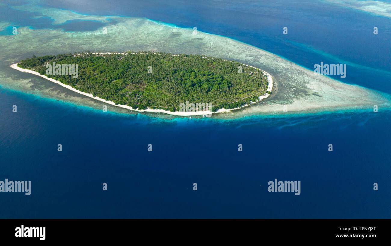 Top view of tropical island with a beach in the ocean. Beautiful sandy ...