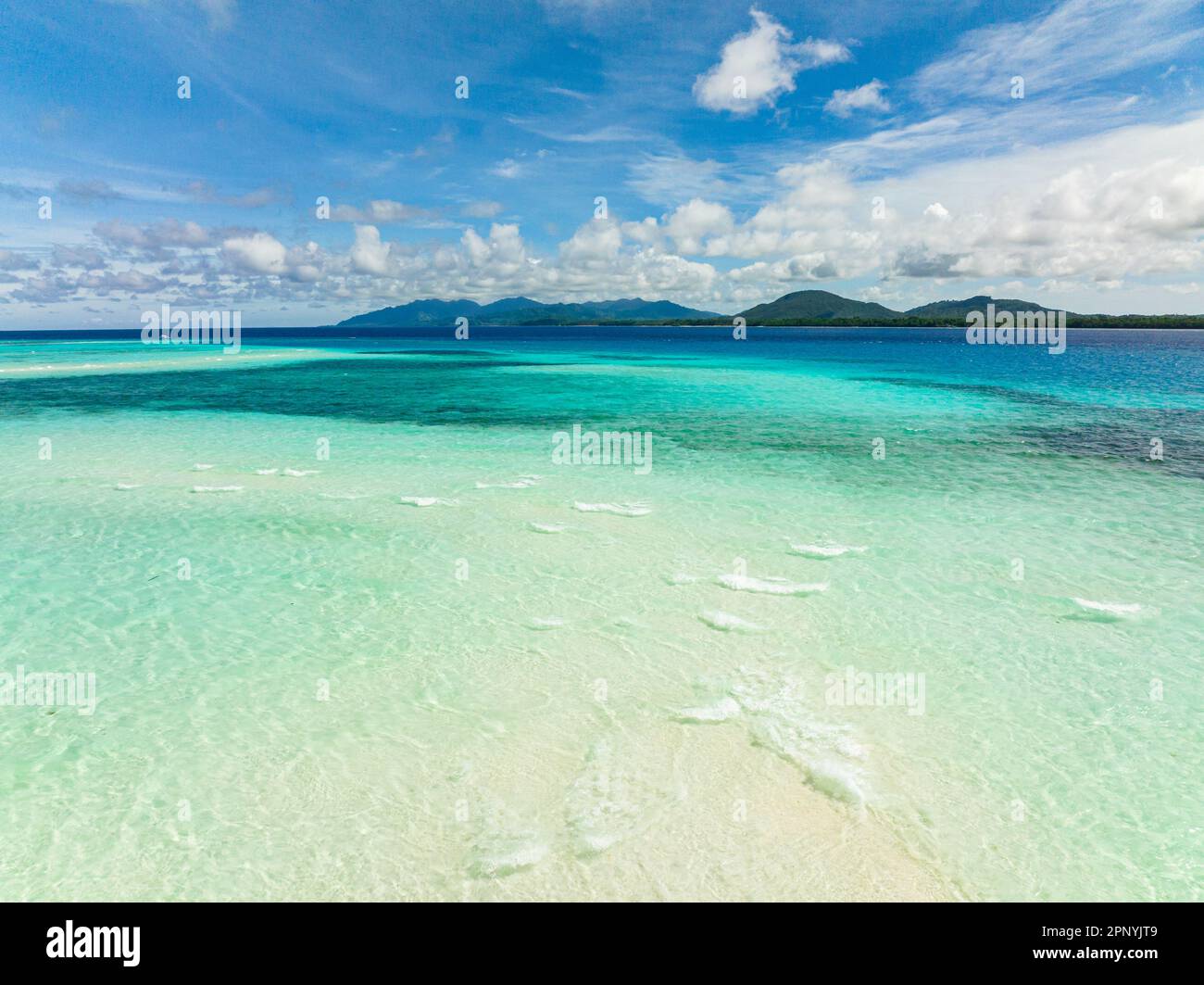 Seascape with tropical sandy beach and blue ocean. Balabac, Palawan ...