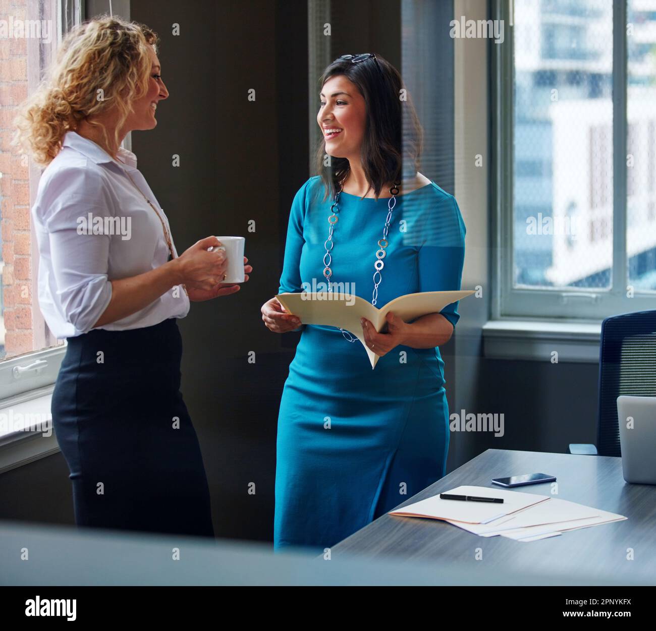 The figures speak for themselves. two businesswomen going over ...