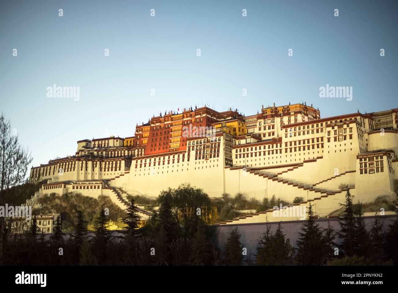 Aerial view of the magnificent Potala Palace perched atop a hill in ...