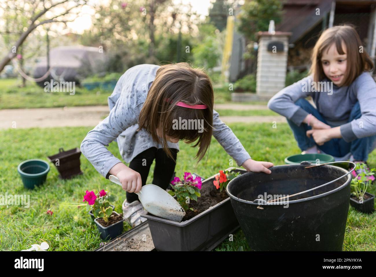 Girl planting flower hi-res stock photography and images - Alamy