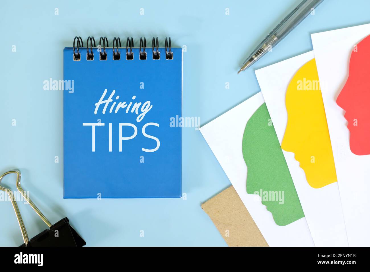 Hiring tips in human resources concept. Office flat lay of blue notepad ...