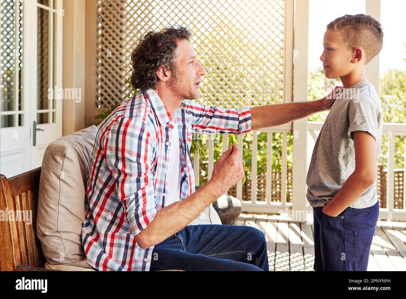 Passing on some fatherly advice. a father talking to his young son ...