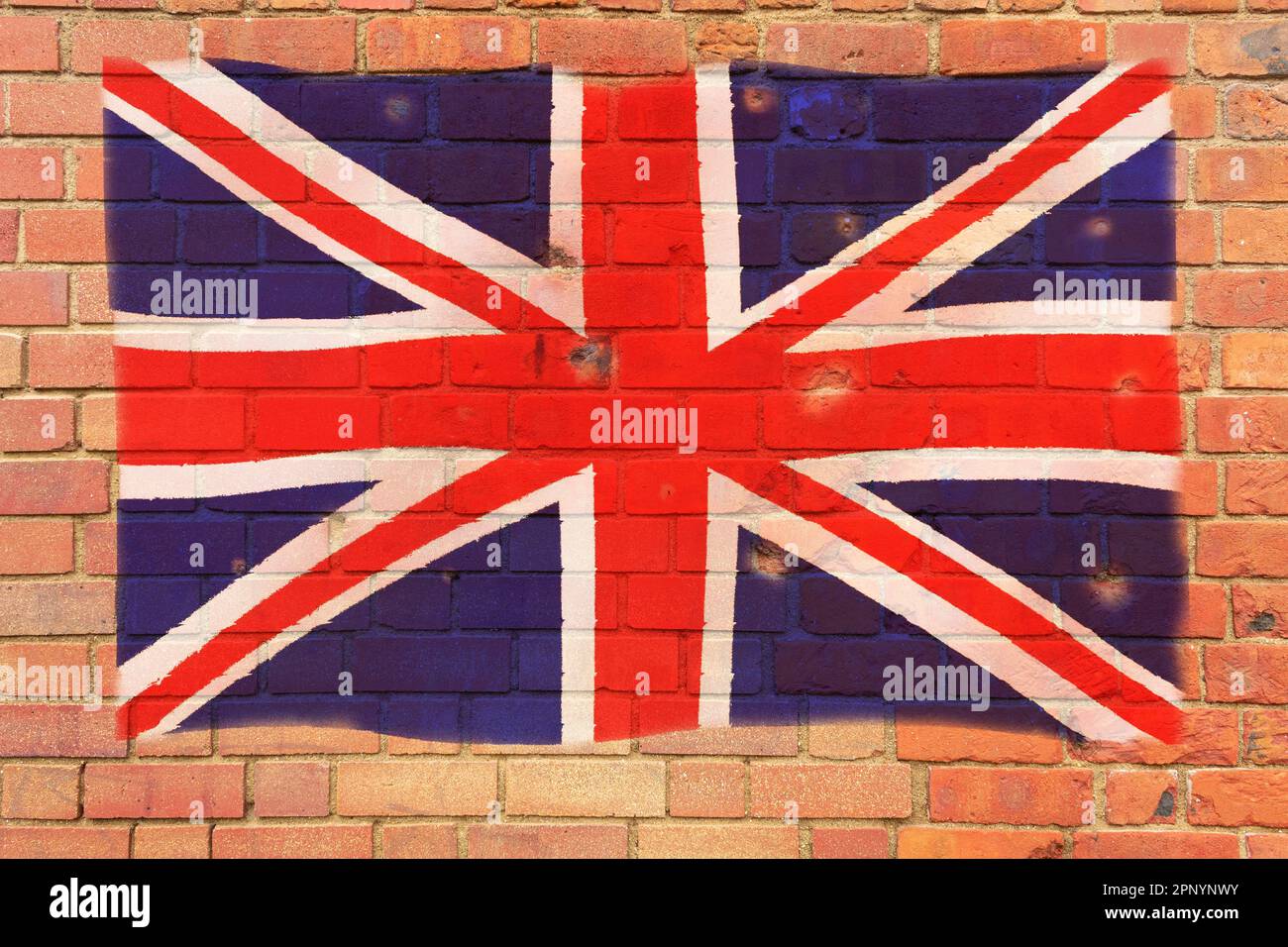 The British flag is painted on a brick wall. Flag on an old stone wall ...