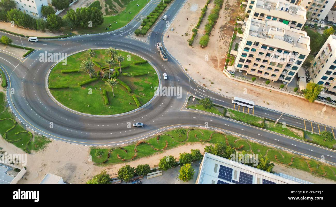 An aerial view of a roundabout in a residential area near a town ...