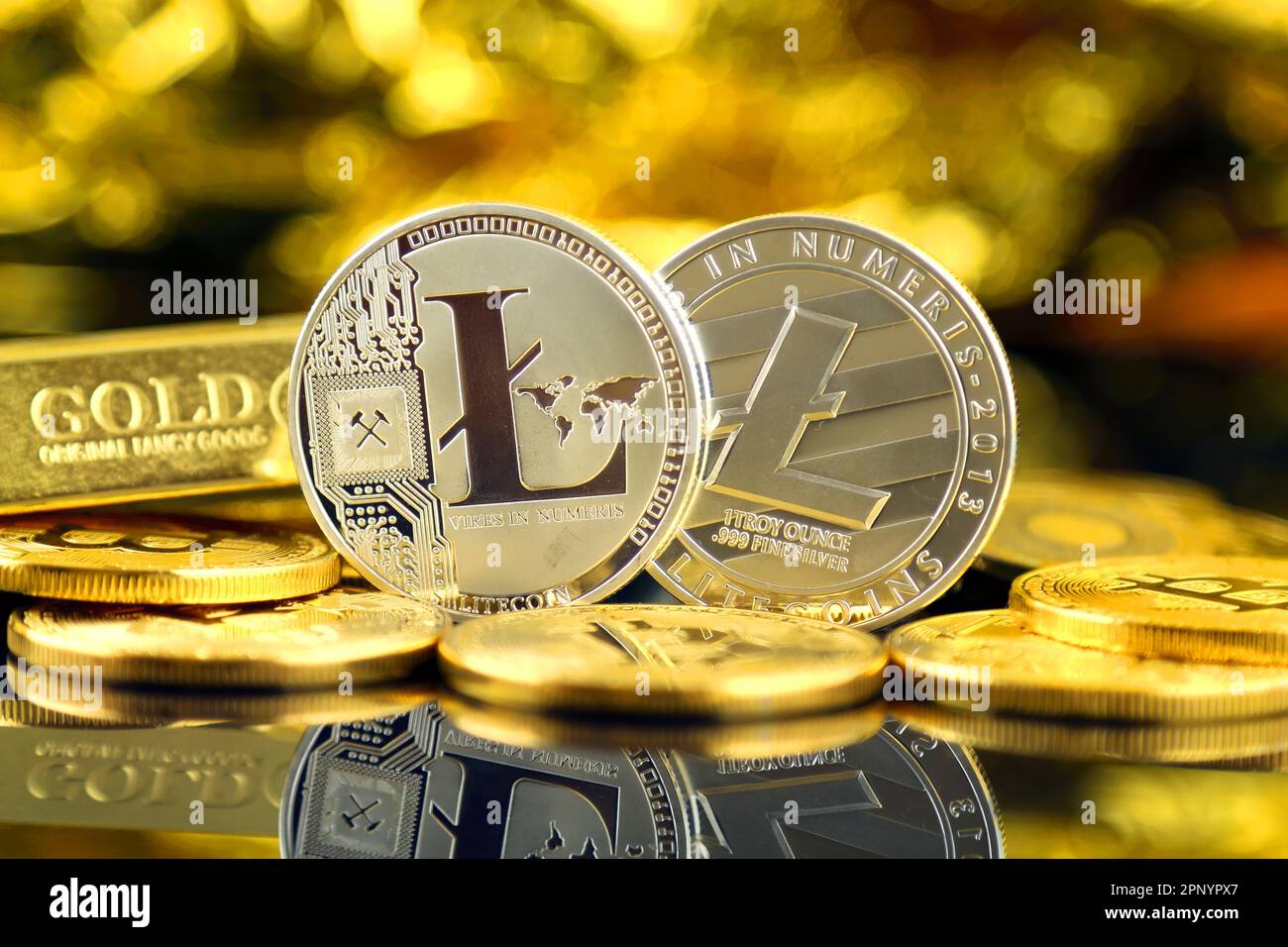 Physical version of Litecoin, new virtual money. Conceptual image for ...