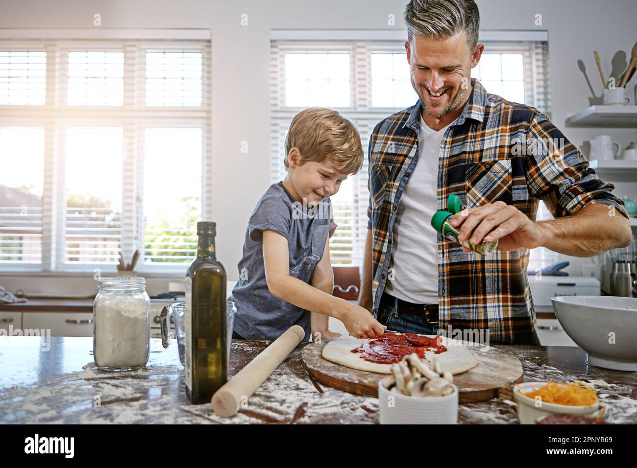 Father son eating pizza playing hi-res stock photography and images - Alamy