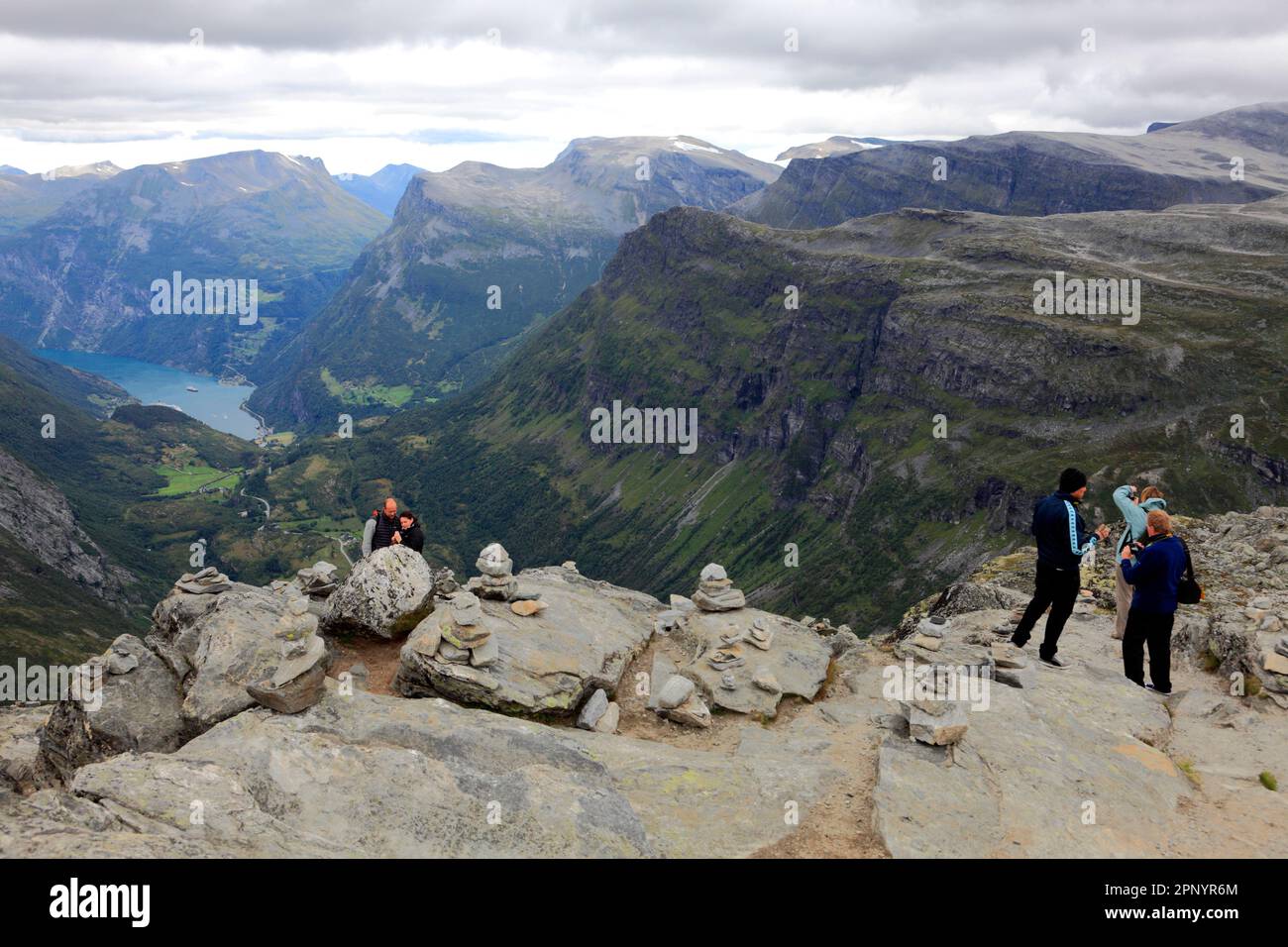 Tourists at the Dalsnibba mountain viewpoint, Geirangerfjord, UNESCO ...