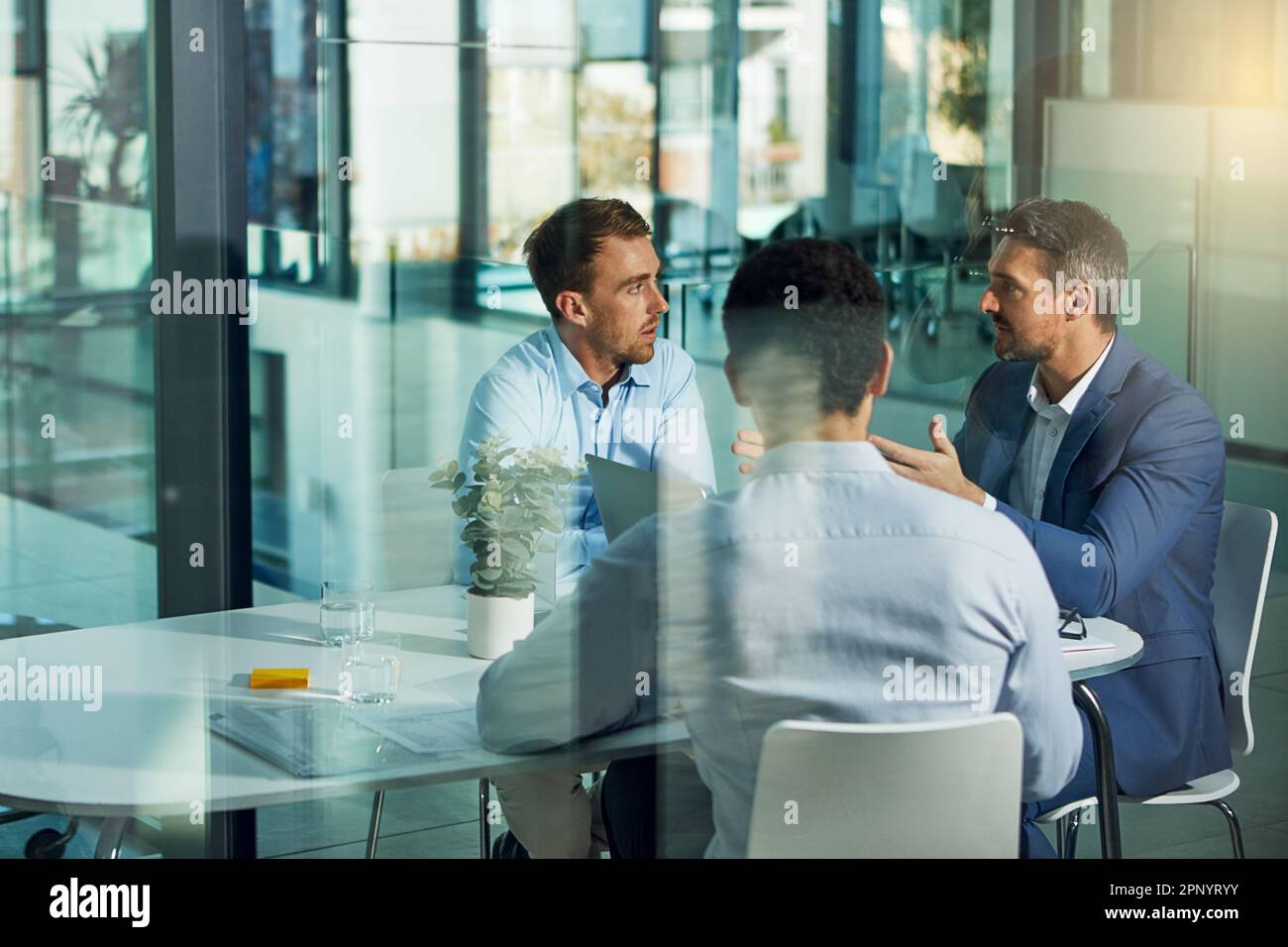 The team hard at work. businessmen having an office meeting Stock Photo ...