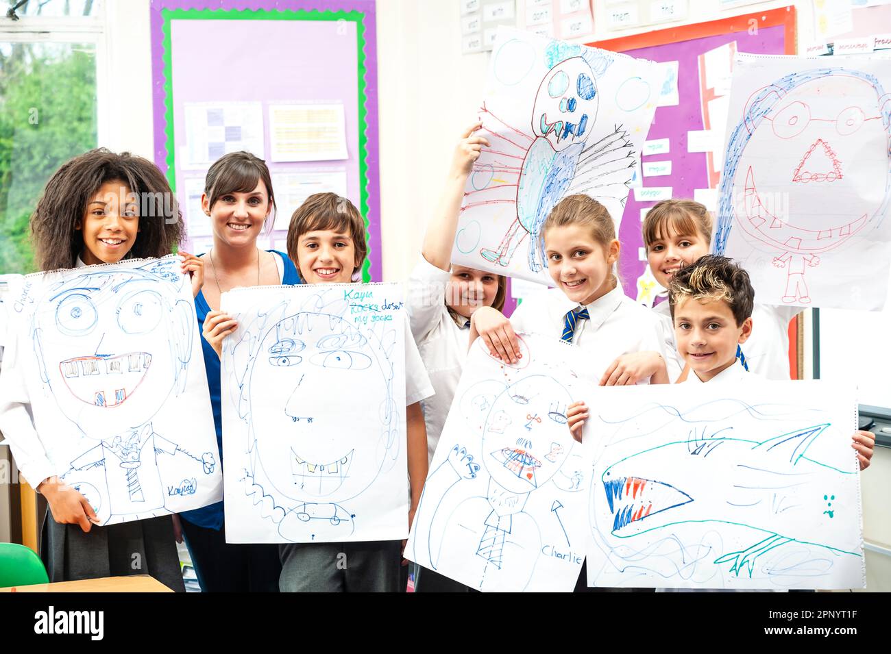 Pupils in our art class with the their teacher showing off their ...