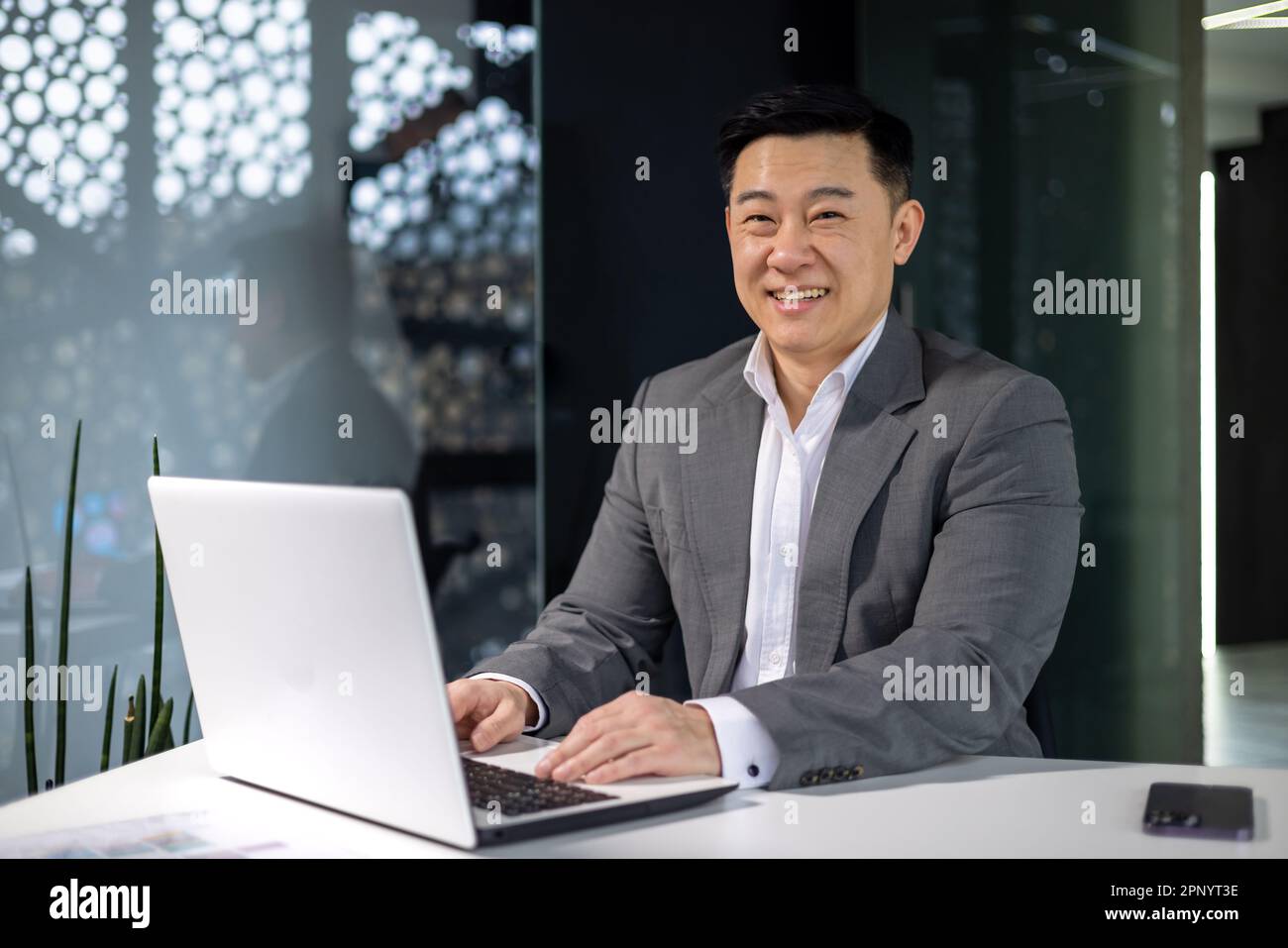 Portrait of successful asian businessman financier, man smiling and ...