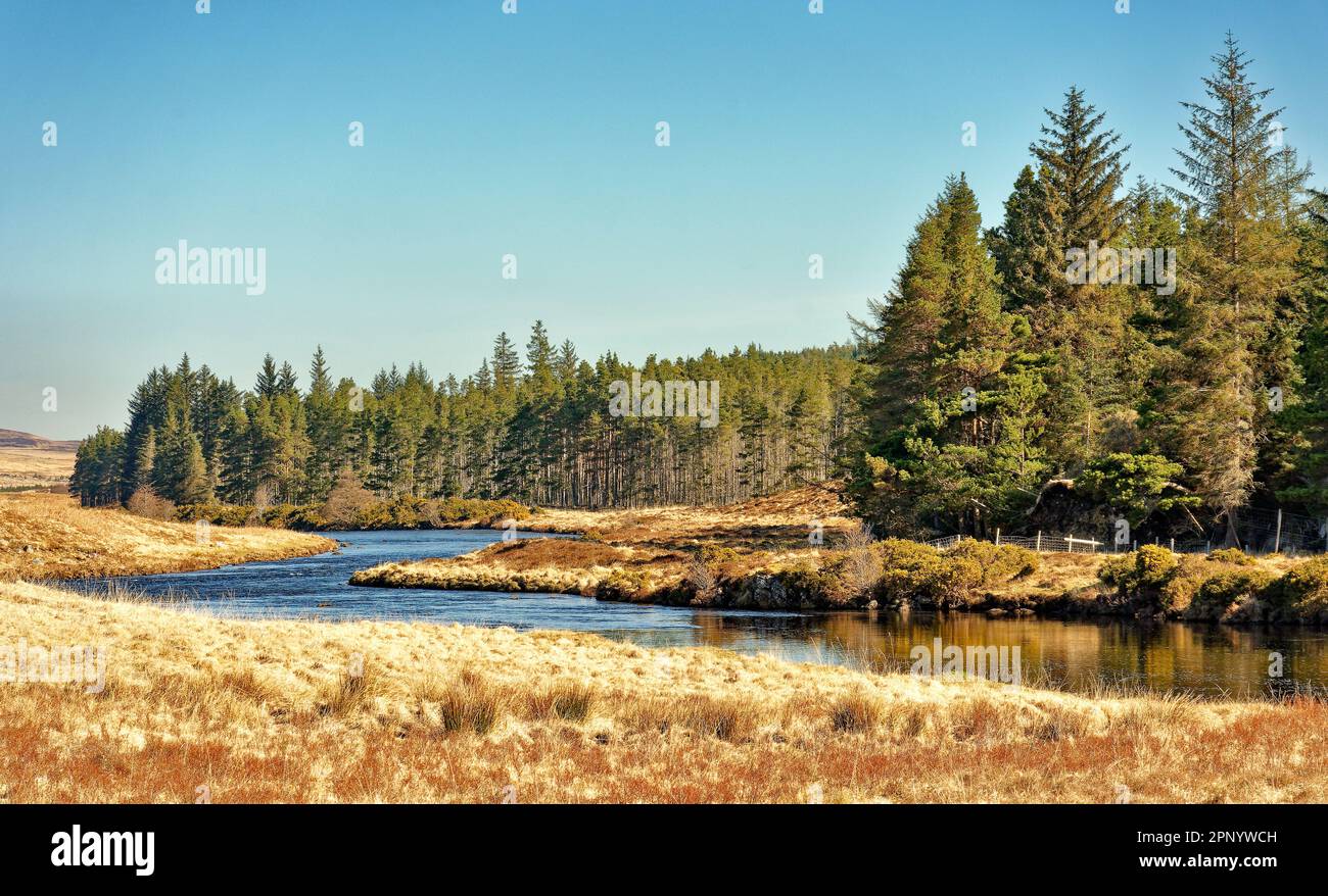 Altnaharra Sutherland Scotland blue sky over the River Naver alongside ...