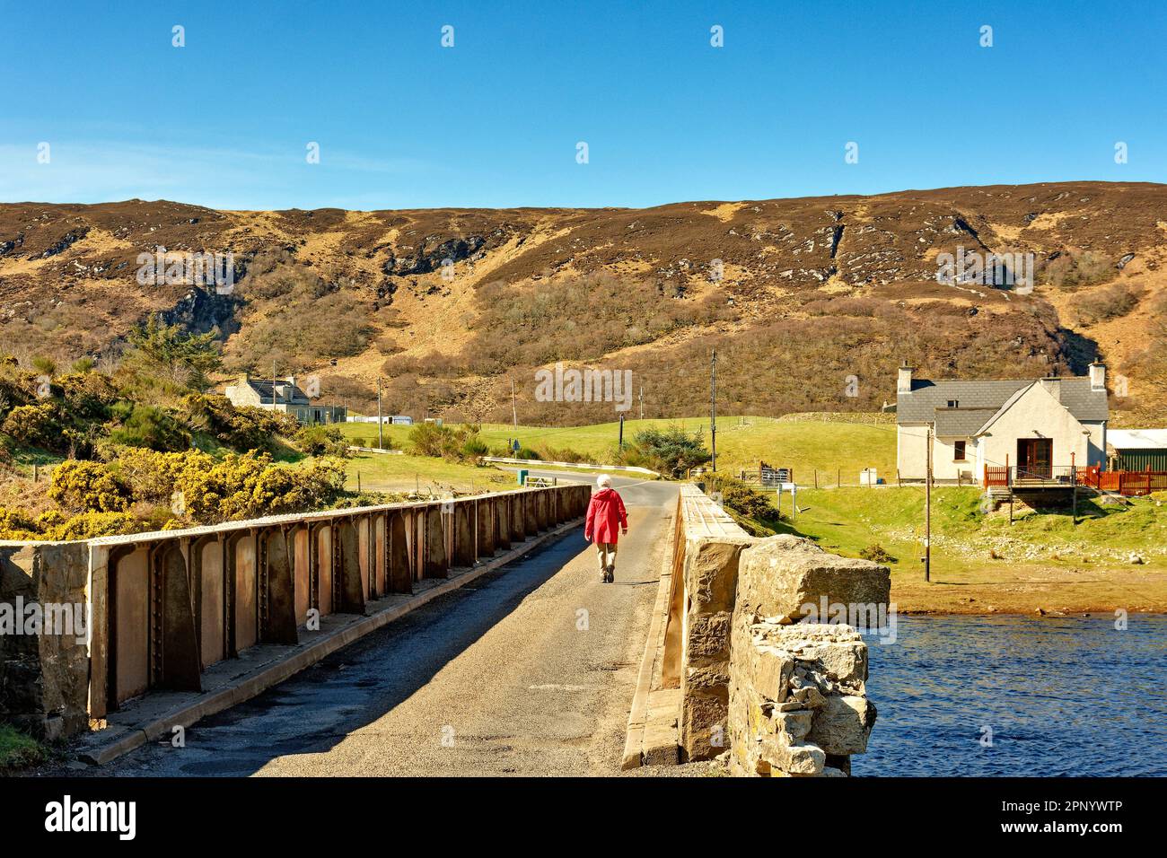 Betty Hill Sutherland Scotland crossing the rusty metal bridge carrying ...