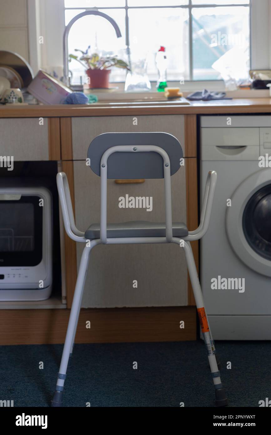 Seating Aid in kitchen at home Stock Photo - Alamy
