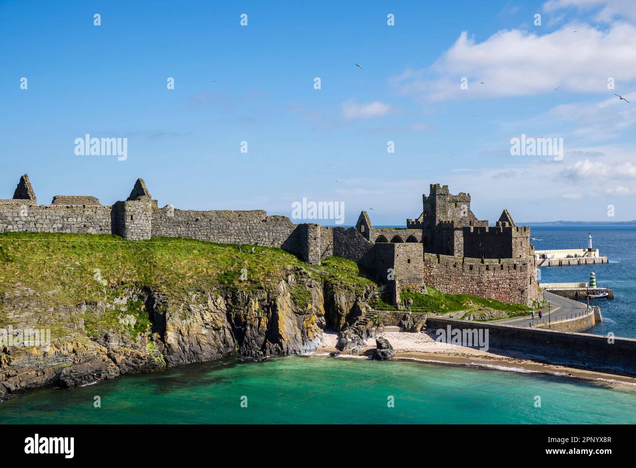 Peel castle on St. Patrick's Isle and Fenella beach seen from the hill ...