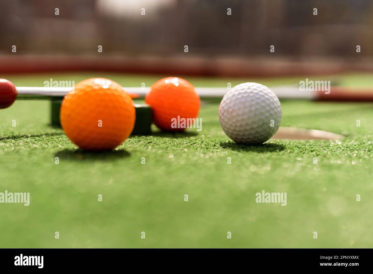 Mini-golf ball on artificial grass. Summer season game Stock Photo - Alamy