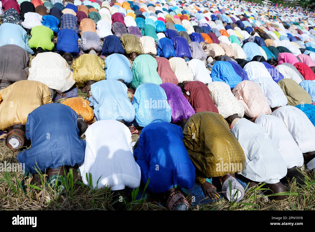 Nigerian Muslims pray in an open ground field during the Eid al-Fitr ...