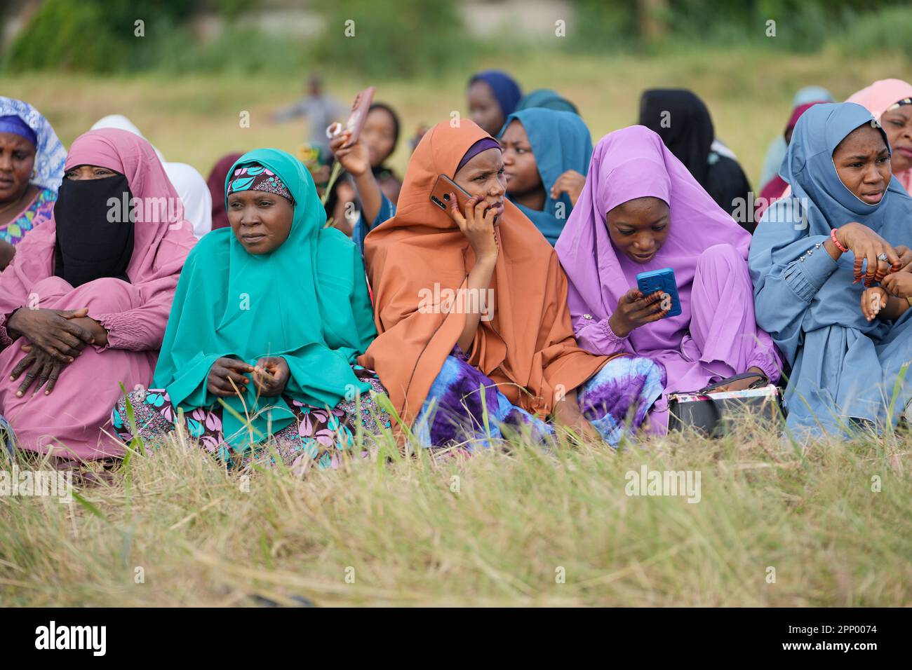 Nigerian Muslims women pray in an open ground field during the Eid al ...