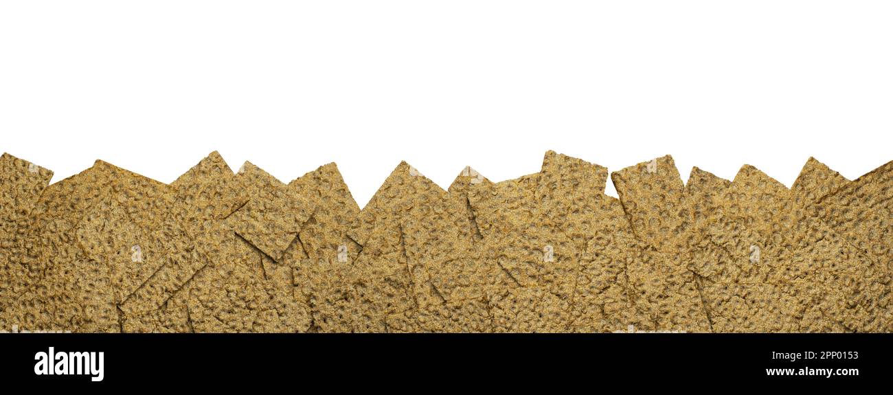 a heap of crispbread on a white background for banner, panorama or ...