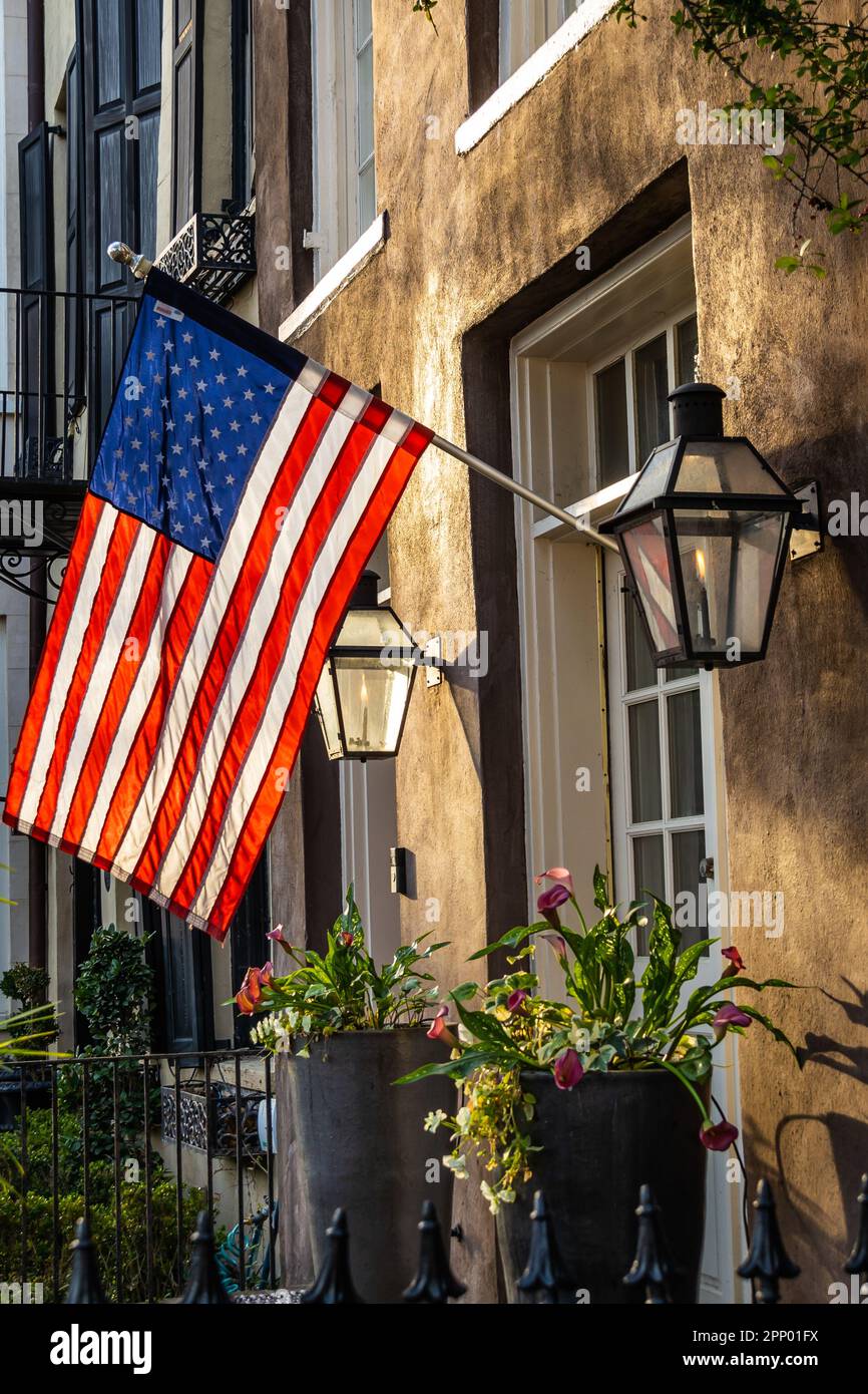 American flag hanging outside house hi-res stock photography and images ...