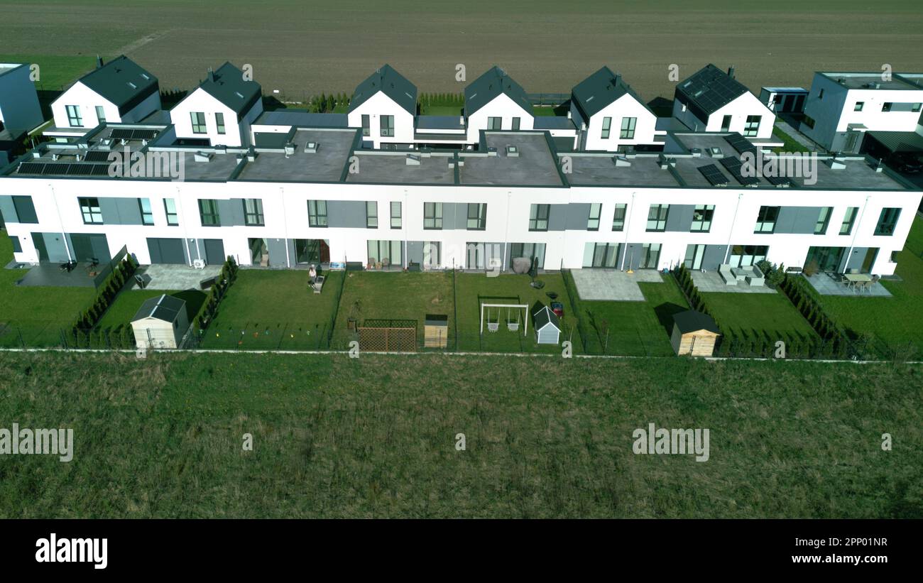 Aerial spring view of warm sunny neighbourhood community houses with ...